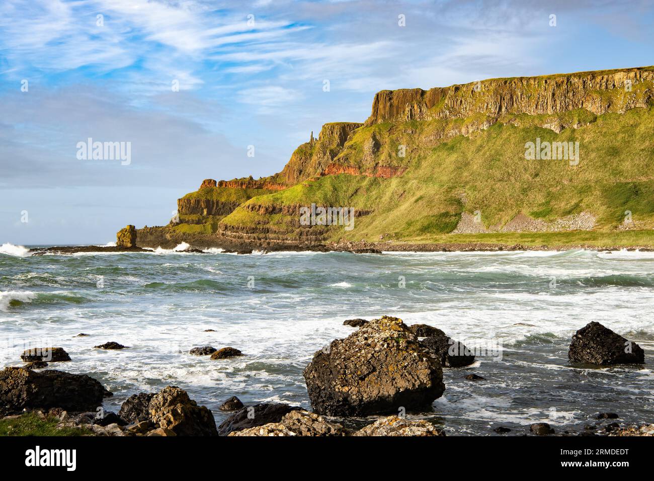 View to cliff with Chimney Stacks rock at Causeway Coast Way path Stock ...
