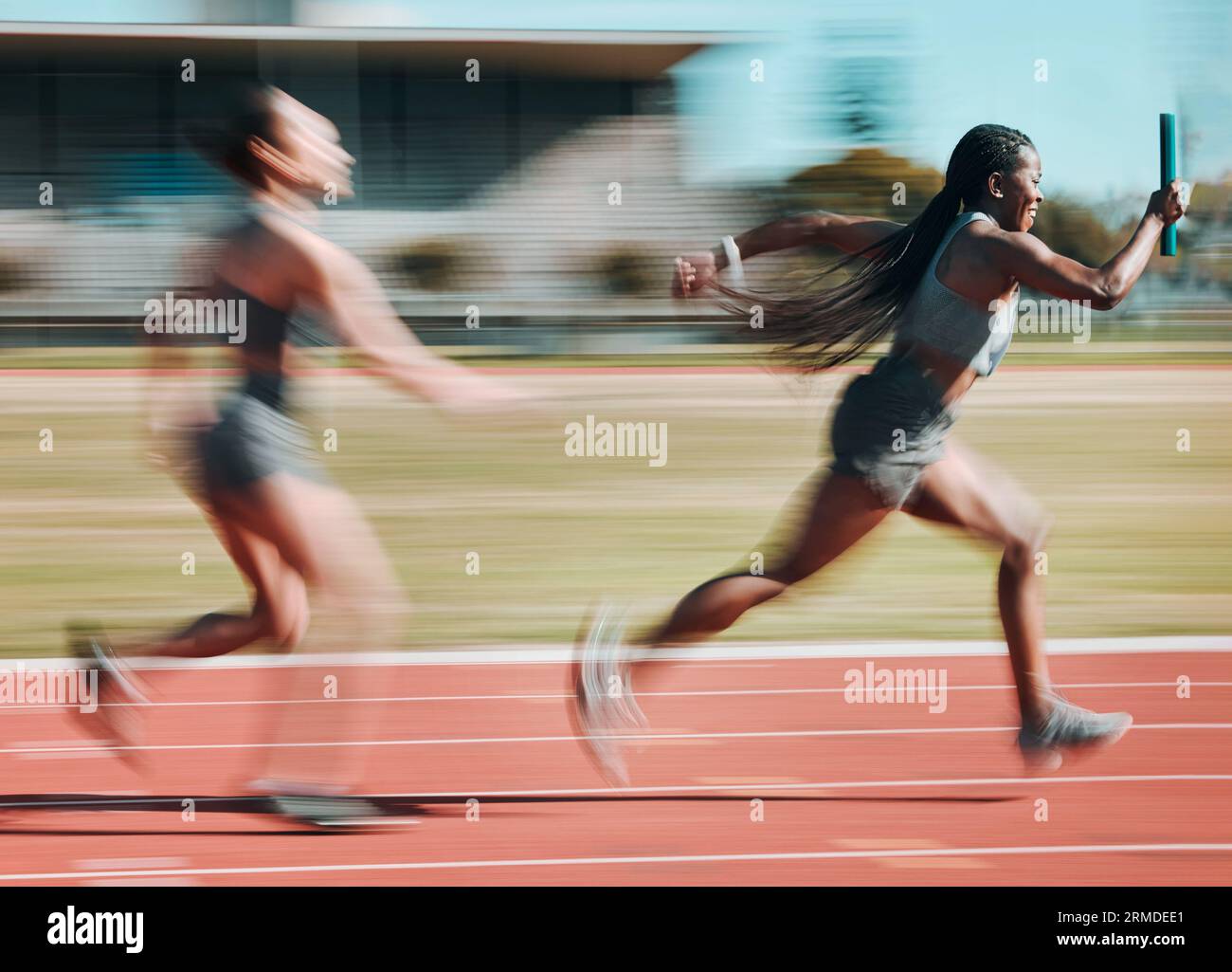 Running a relay race hi-res stock photography and images - Alamy