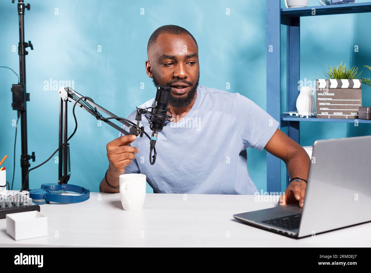 African man reading into microphone hi-res stock photography and images ...