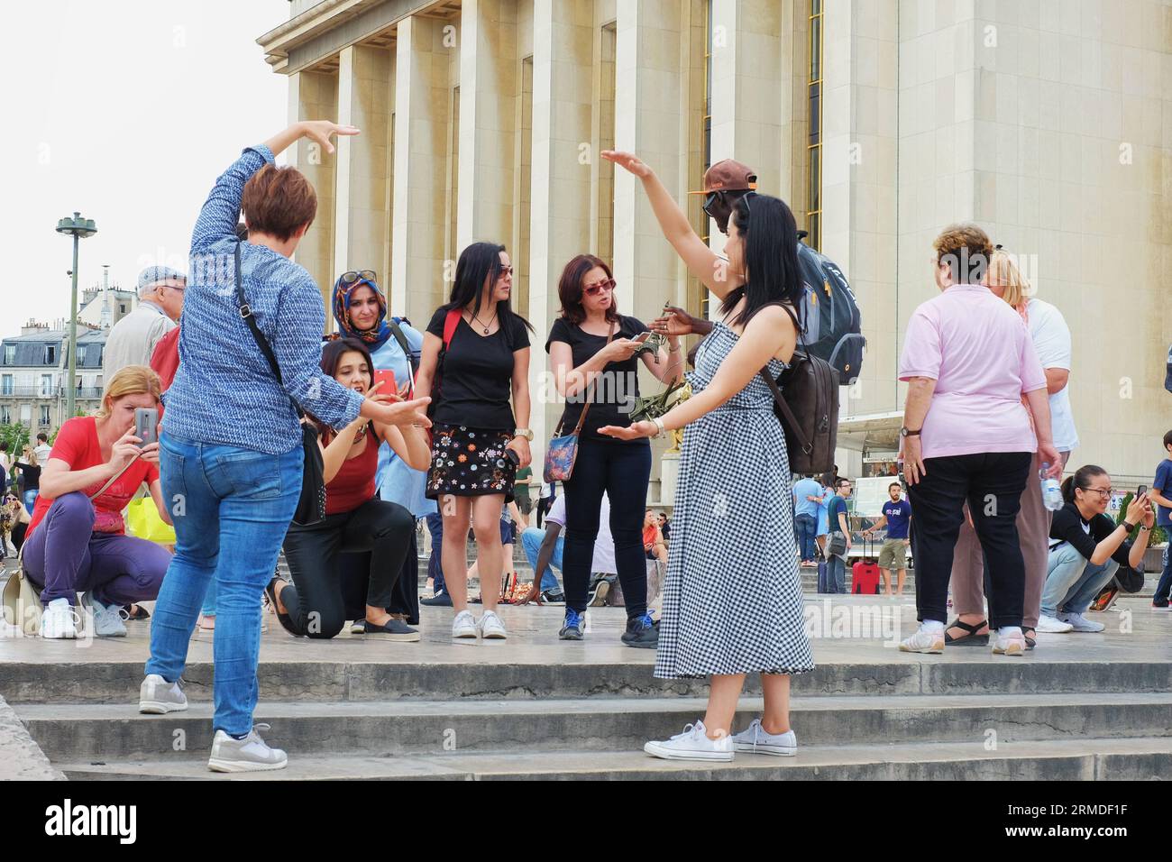 Tourists being photographed 'holding the Eiffel Tower' from the high ...