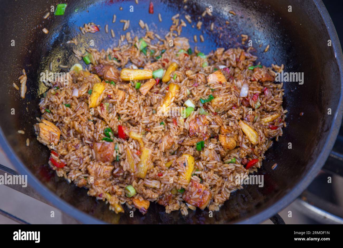 Pineapple Pork Fried Rice in a wok Stock Photo - Alamy