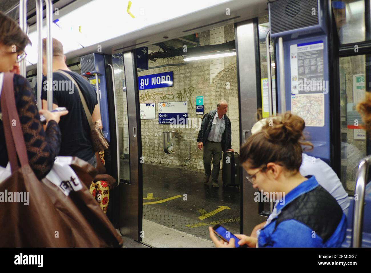 Looking out the open carriage doors at the Gare Du Nord Metro platform ...