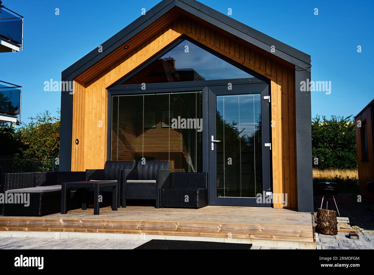 Relax corner with garden furniture at house terrace. Lounge zone in ...