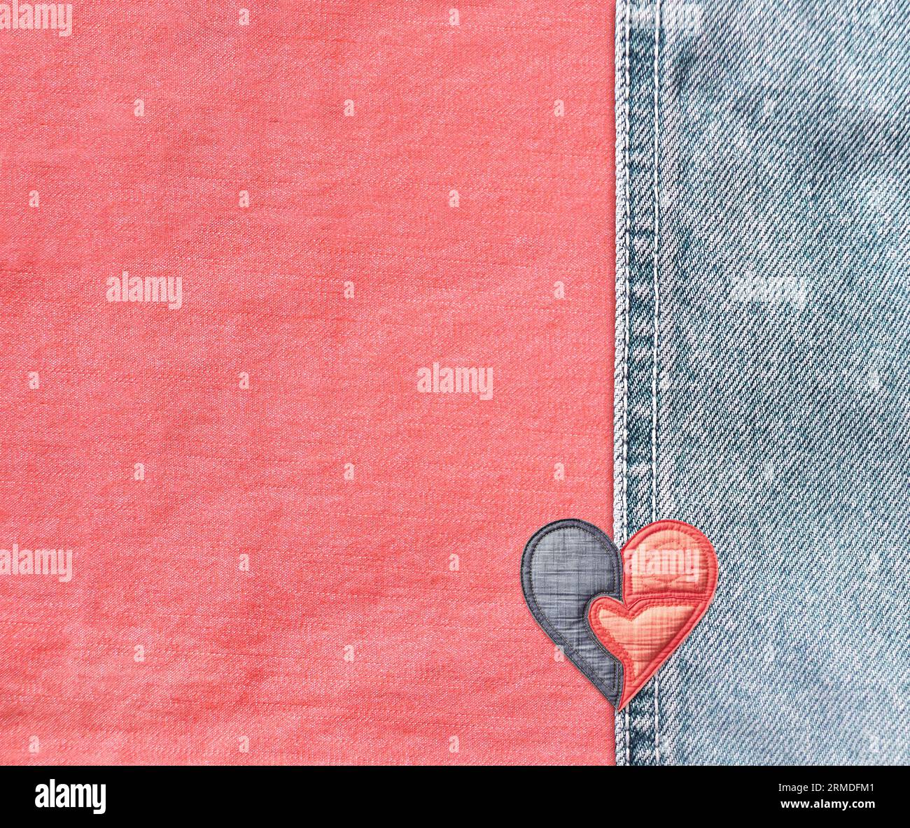 Pink and light blue denim background with a seam and felt heart. Coral ...