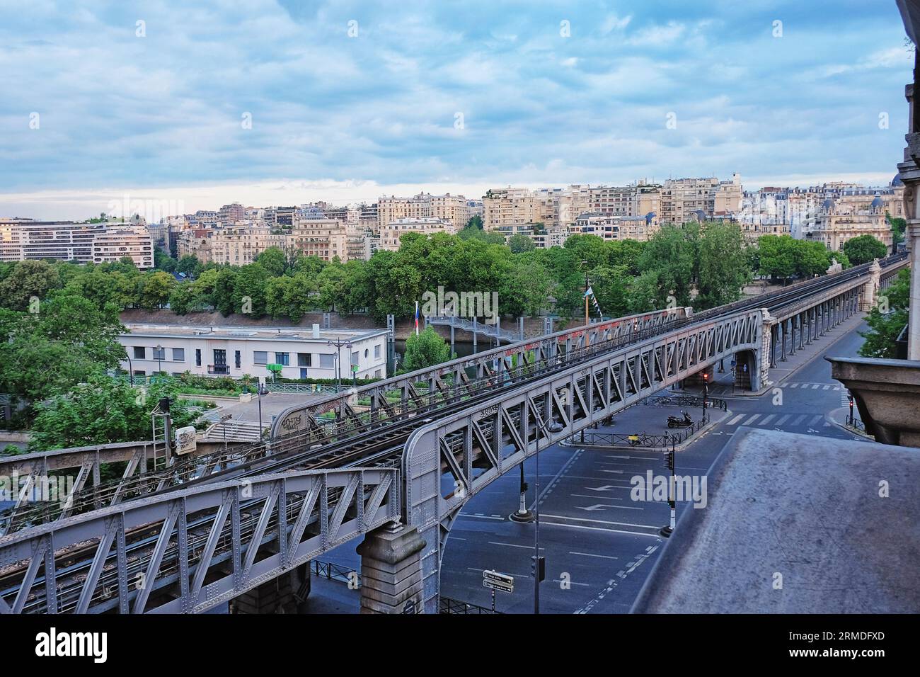 Open truss work spans of the iron Metro viaduct as it abuts Pont de Bir ...