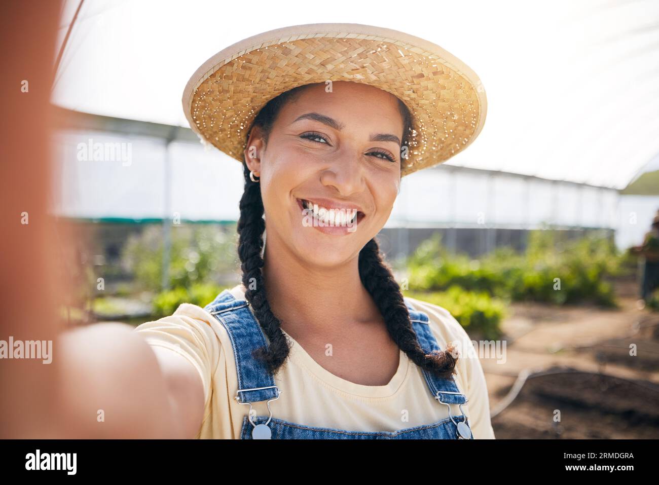 Selfie, smile and a woman in a farm greenhouse for agriculture or ...