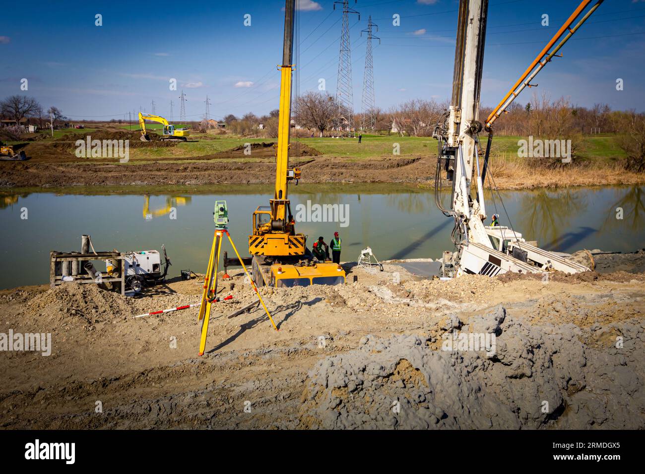 Pouring fresh concrete in bridge foundation, under construction on ...