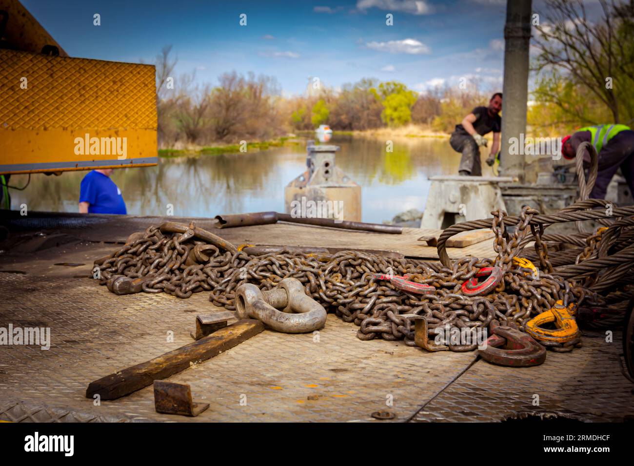 View on pile of used chain with hooks and steel cable for lifting of ...