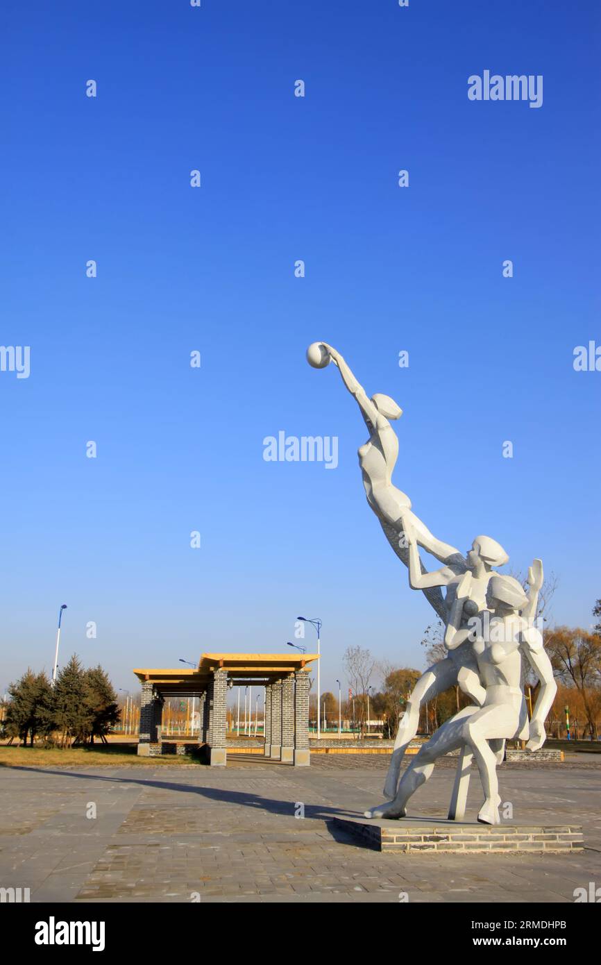 women's volleyball movement sculpture, under the blu sky Stock Photo ...