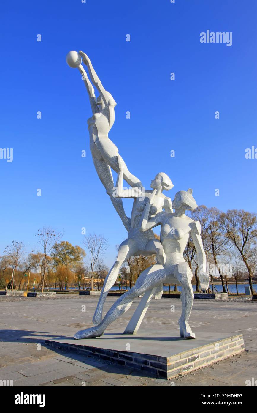 women's volleyball movement sculpture, under the blu sky Stock Photo ...