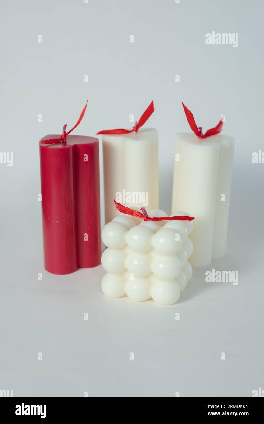 Candles with a red bow Stock Photo - Alamy