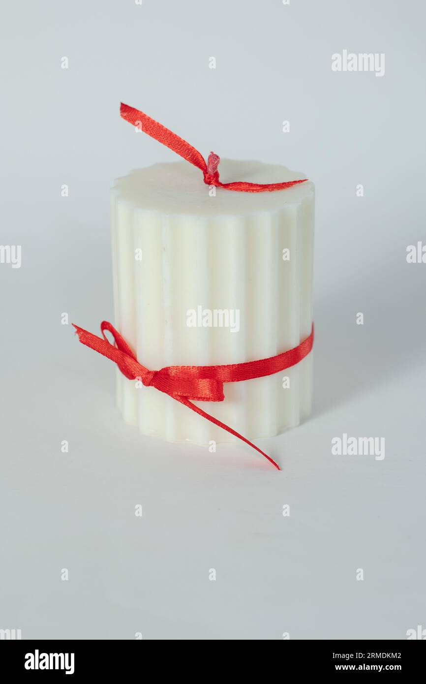 Candles with a red bow Stock Photo - Alamy