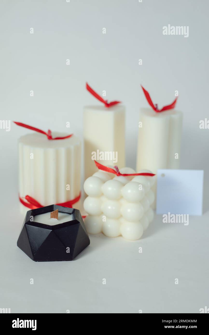 Candles with a red bow Stock Photo - Alamy