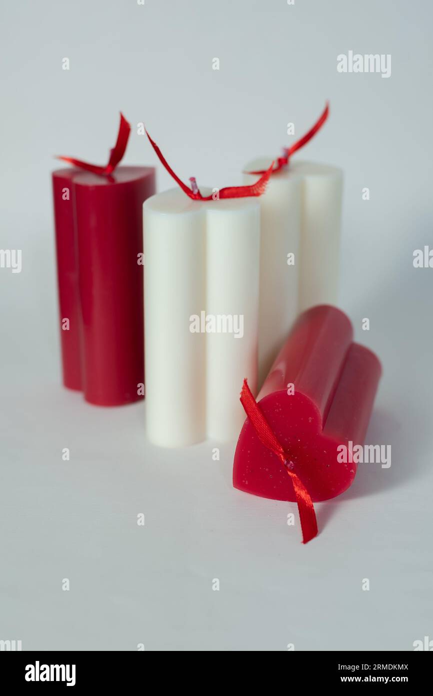 Candles with a red bow Stock Photo - Alamy