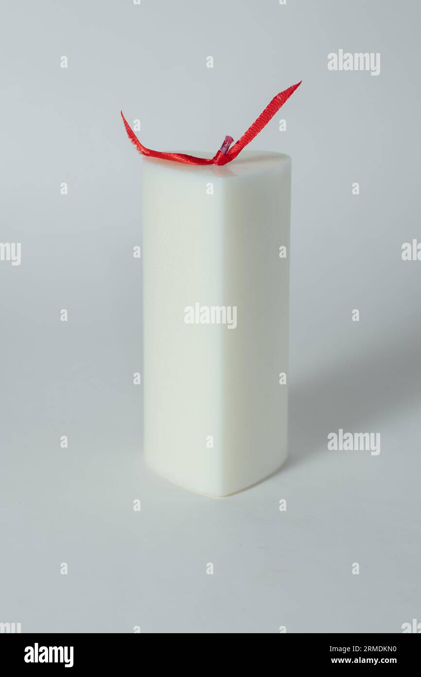 Candles with a red bow Stock Photo - Alamy