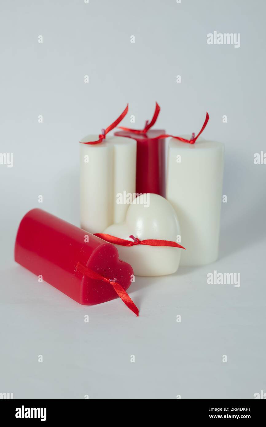 Candles with a red bow Stock Photo - Alamy
