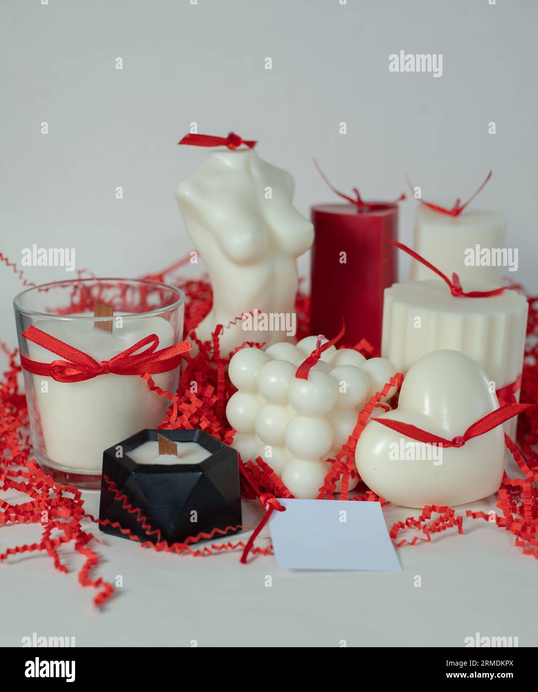 Candles with a red bow Stock Photo - Alamy