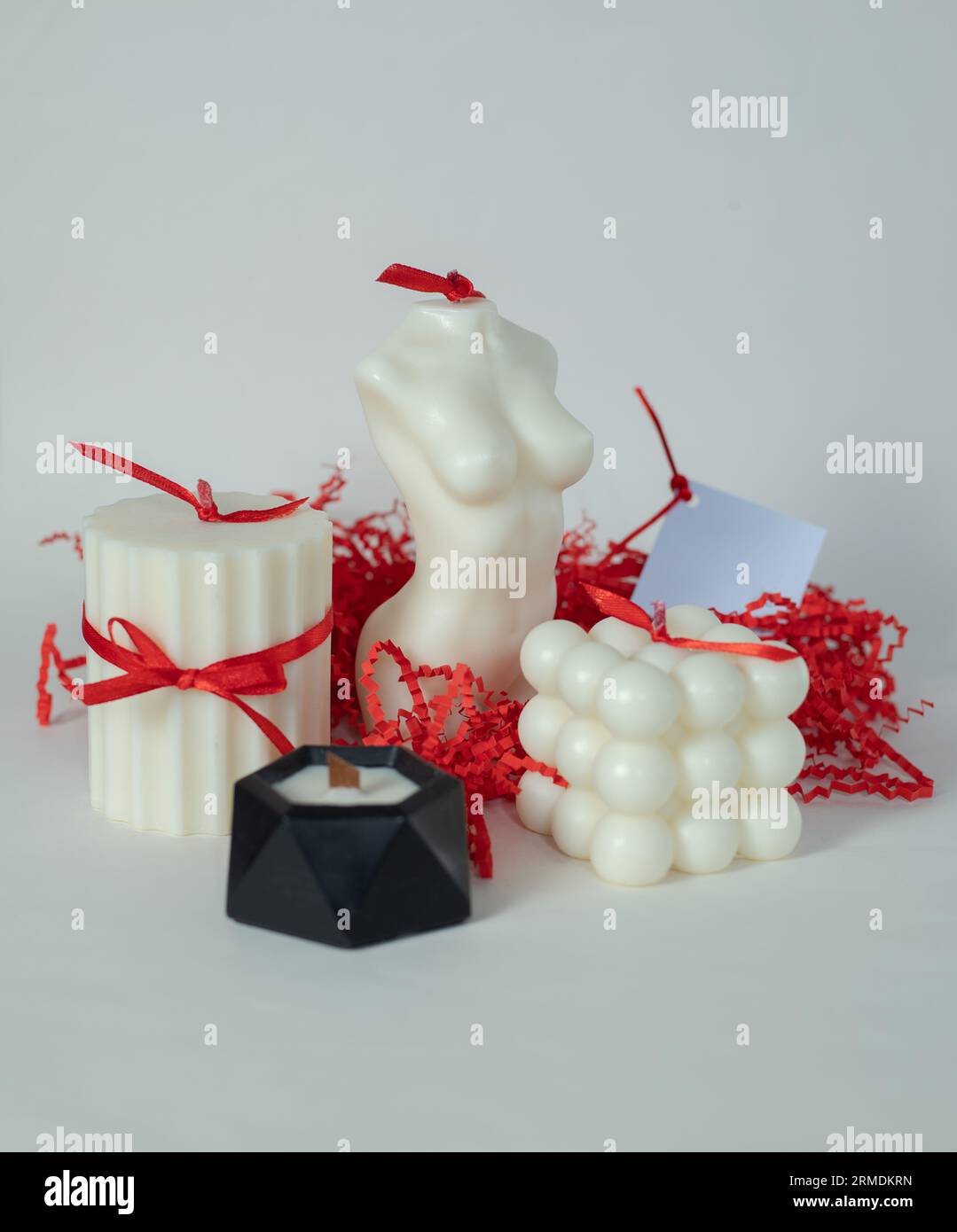 Candles with a red bow Stock Photo - Alamy