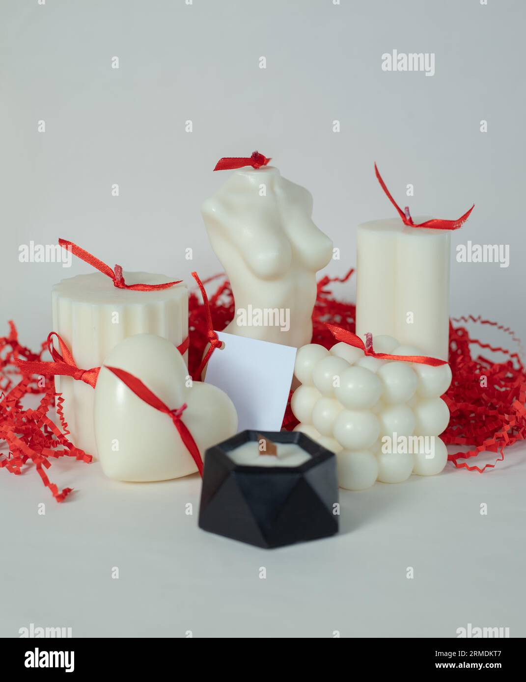 Candles with a red bow Stock Photo - Alamy