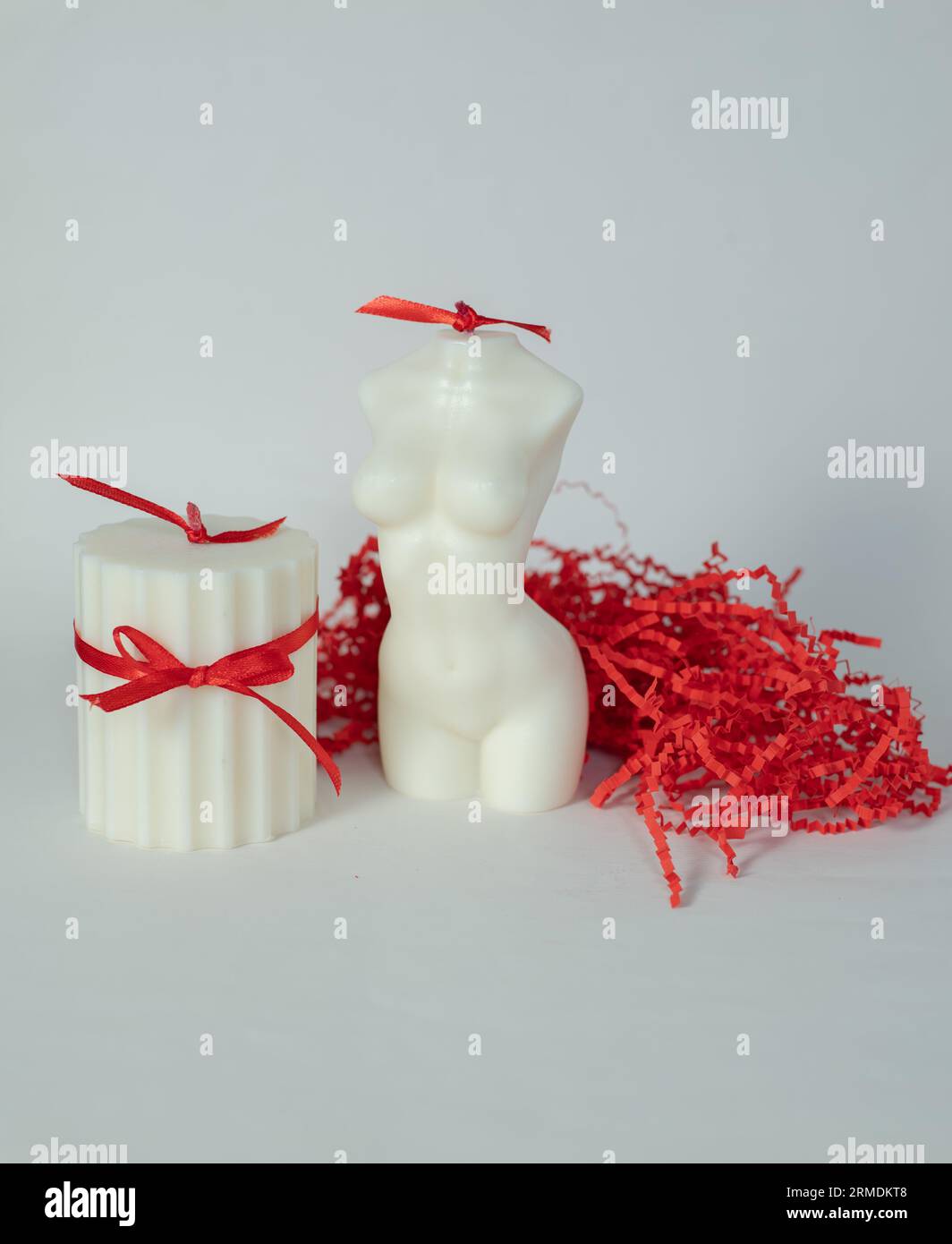 Candles with a red bow Stock Photo - Alamy