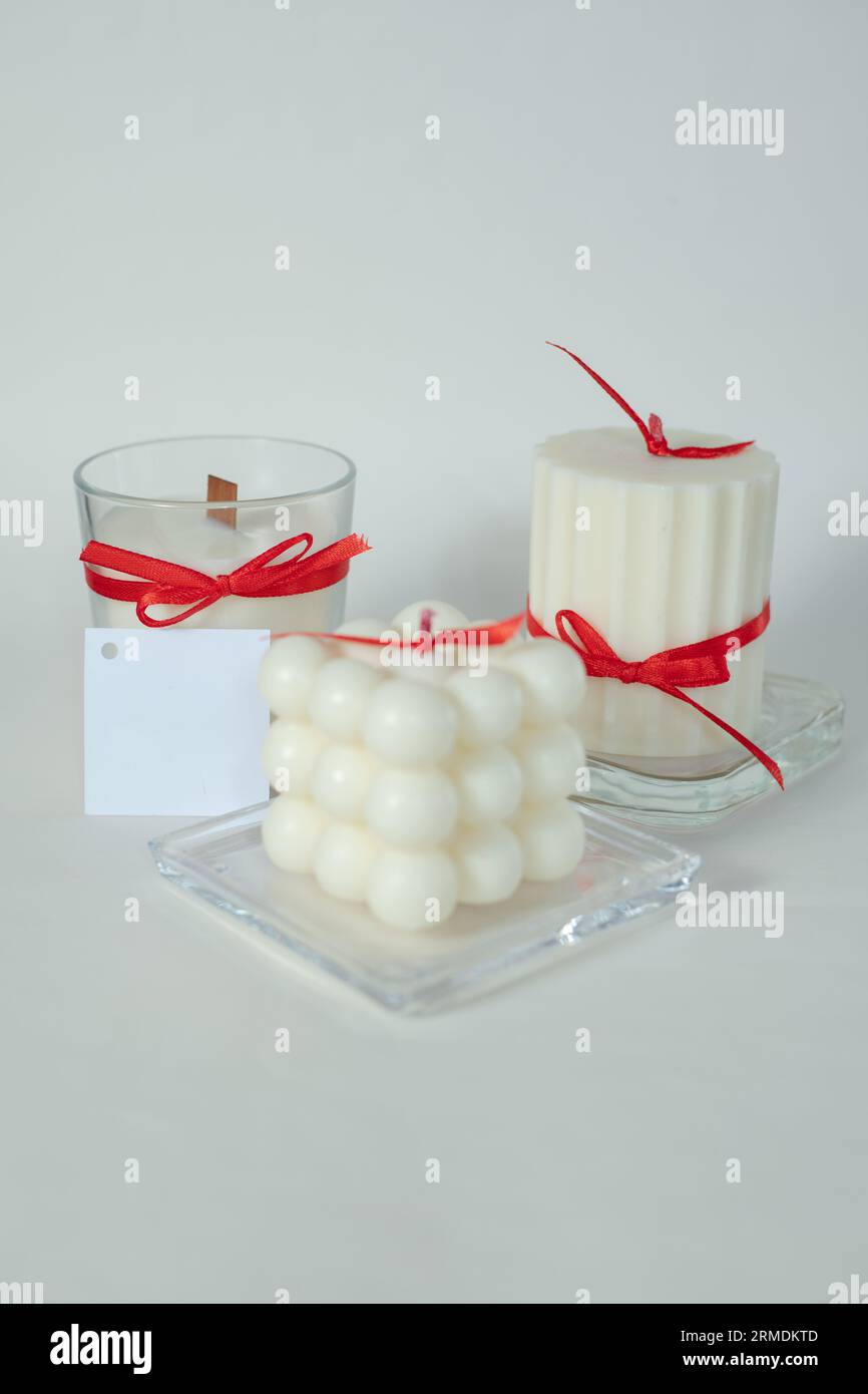 Candles with a red bow Stock Photo - Alamy