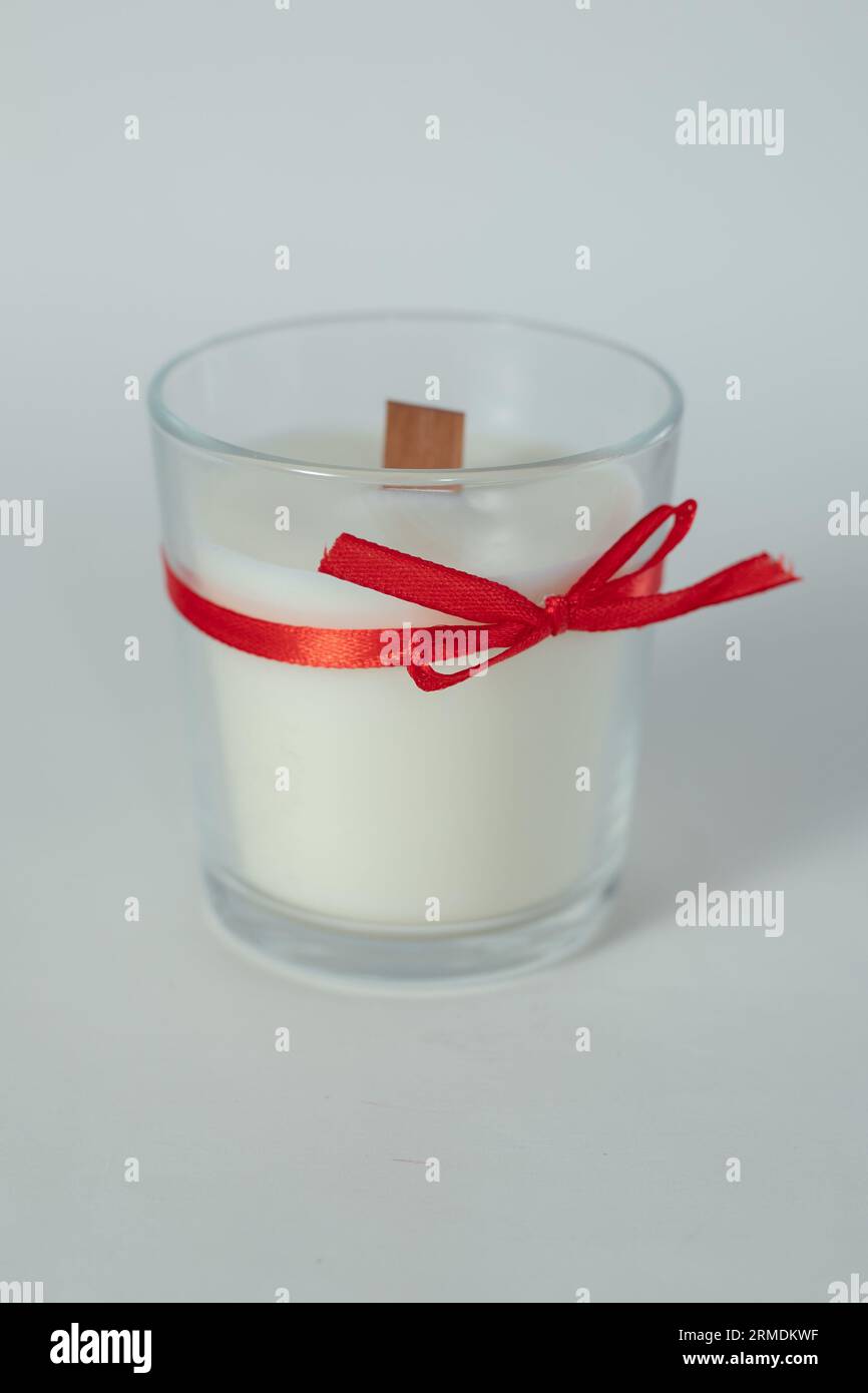 Candles with a red bow Stock Photo - Alamy
