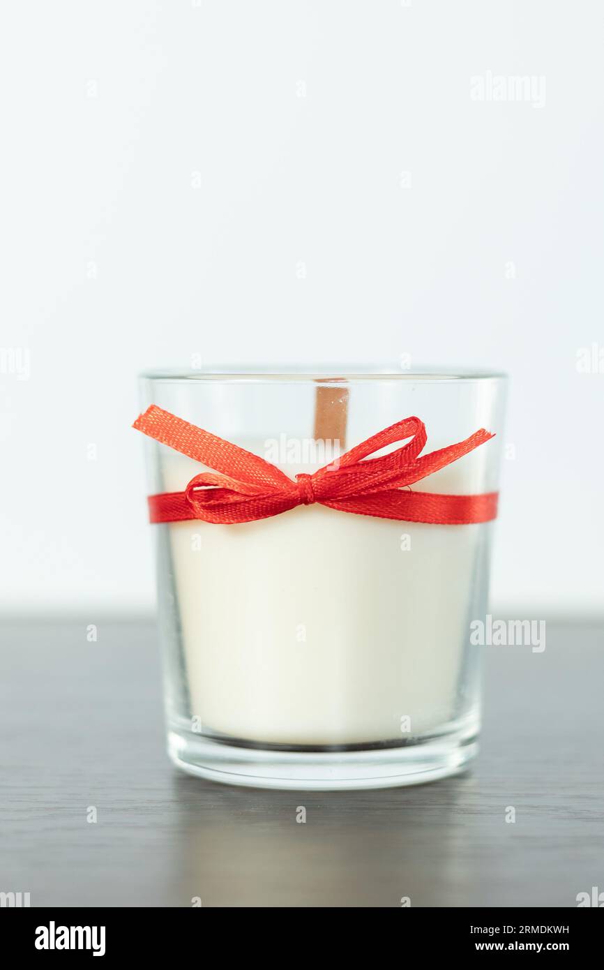 Candles with a red bow Stock Photo - Alamy