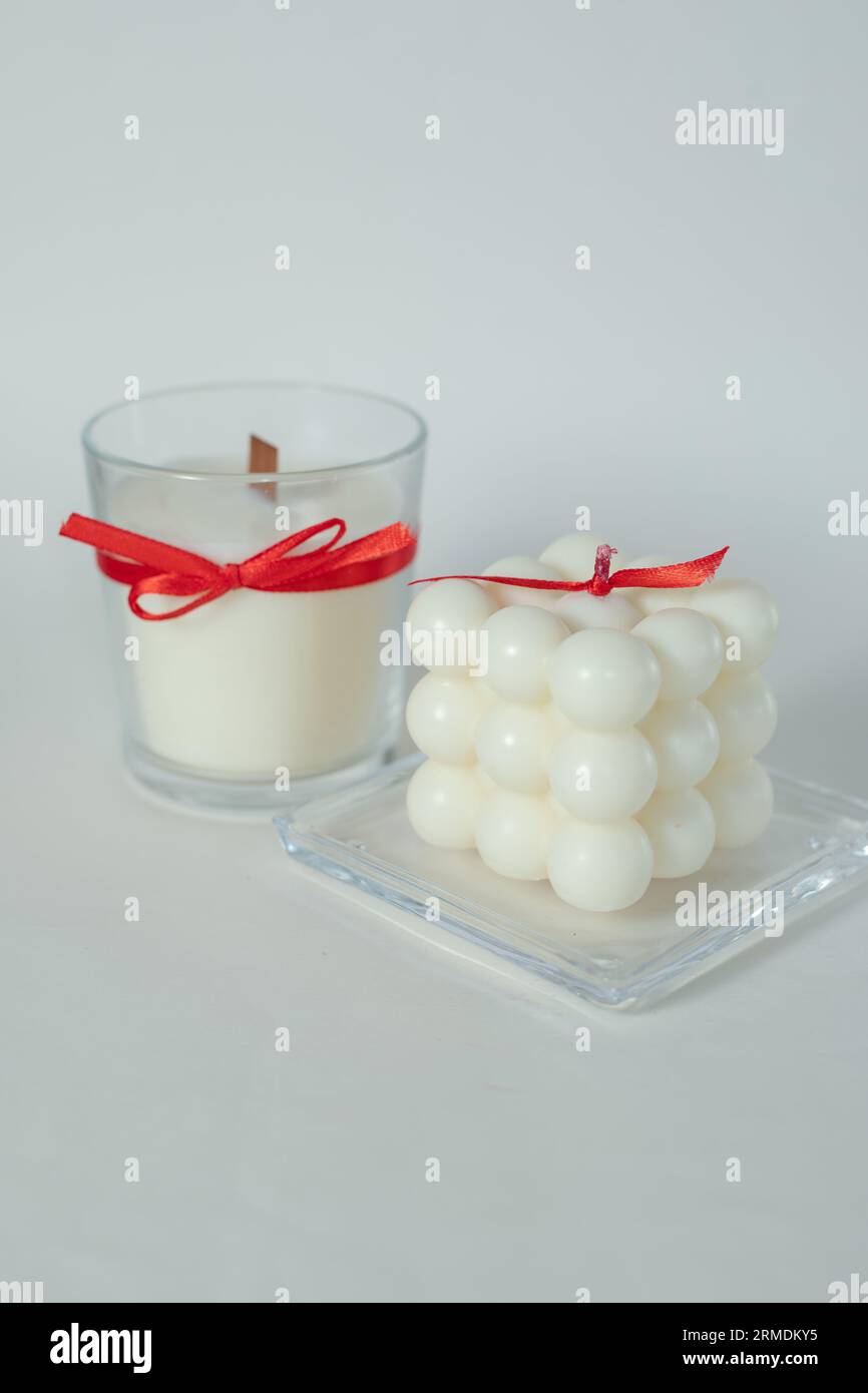 Candles with a red bow Stock Photo - Alamy