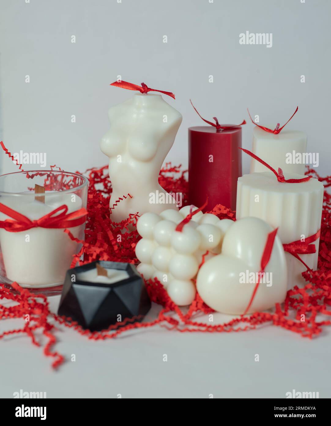 Candles with a red bow Stock Photo - Alamy
