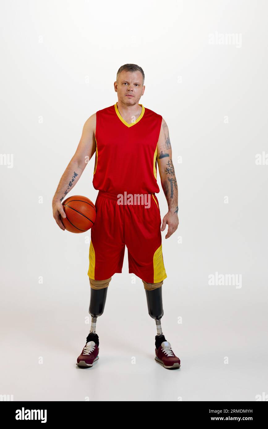 Attractive young man amputee with prosthetic leg disability standing ...