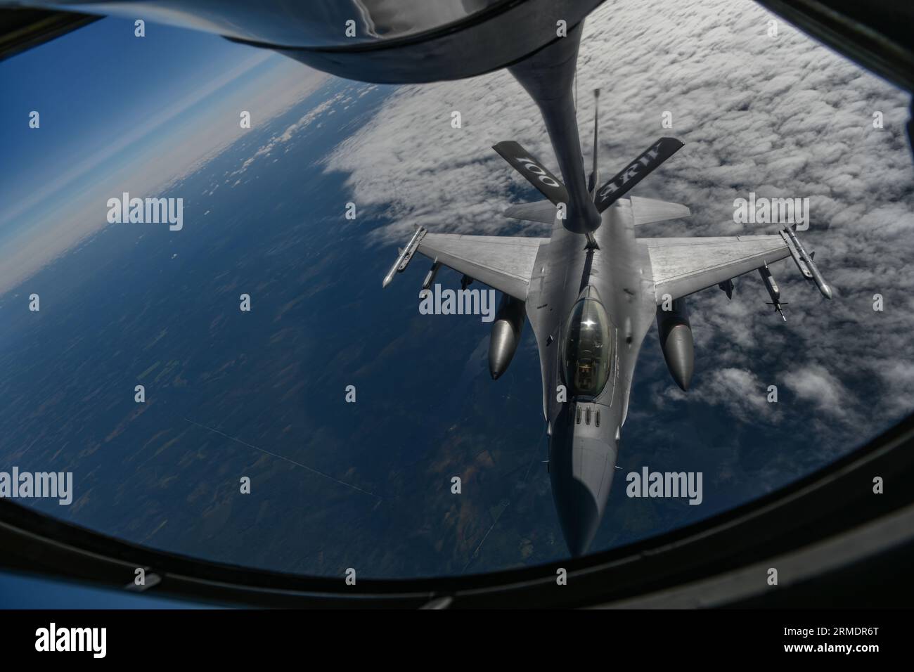 A U.S. Air Force F-16 receives air-to-air refueling from a KC-135 over ...