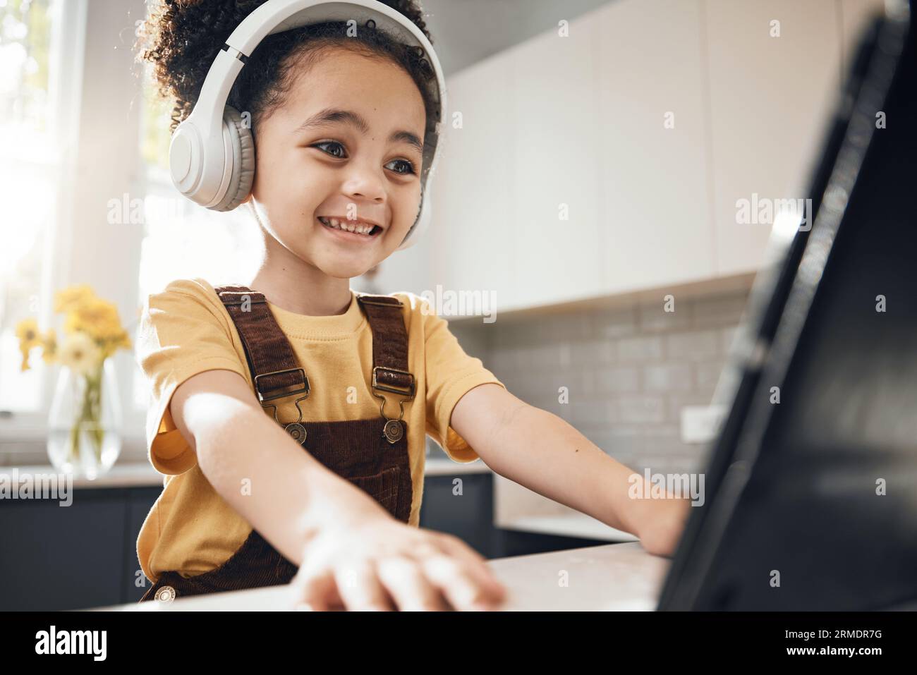 Headphones, tablet and kid elearning in home, happy and online ...