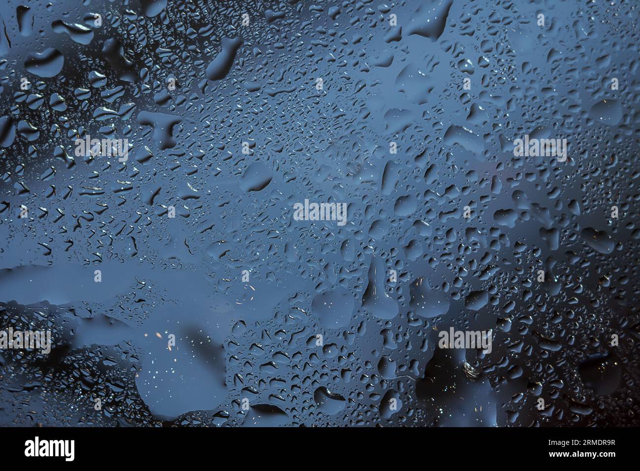 Raindrops on a clear window create a wet and rainy background Stock ...