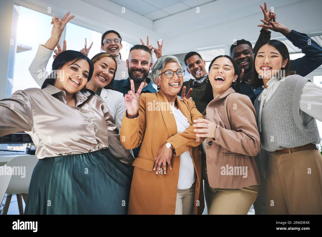 Happy, peace sign and portrait of business people in the office for ...