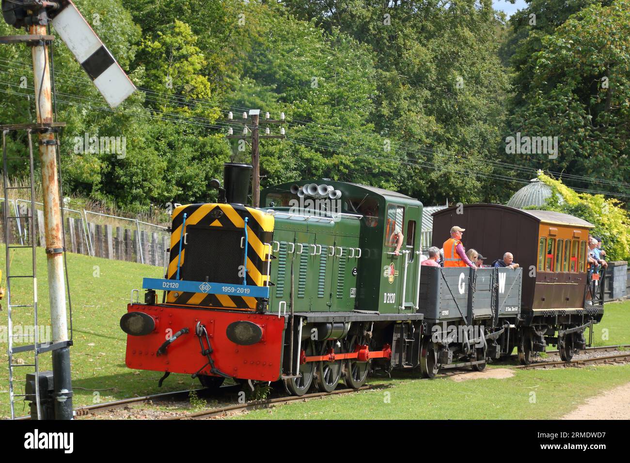 Visitors travelling on a train at Lady McAlpine's estate in Fawley Hill ...