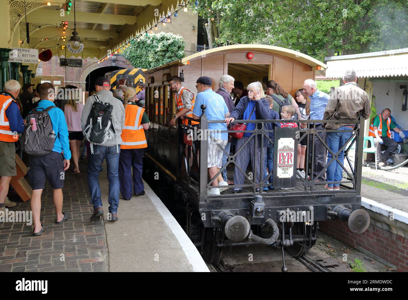 Visitors travelling on a train at Lady McAlpine's estate in Fawley Hill ...