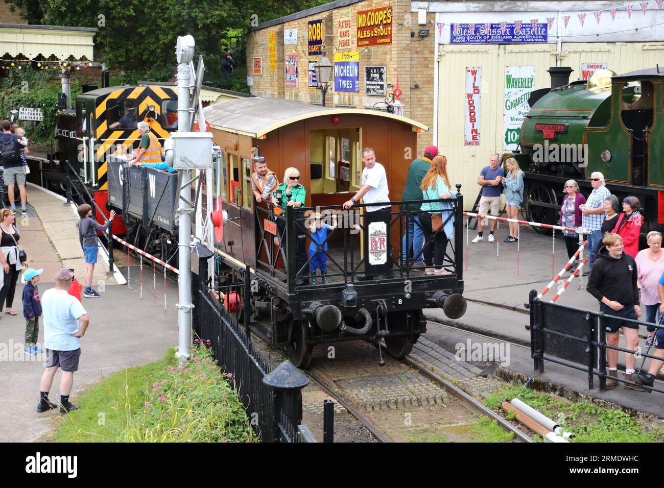 Visitors travelling on a train at Lady McAlpine's estate in Fawley Hill ...