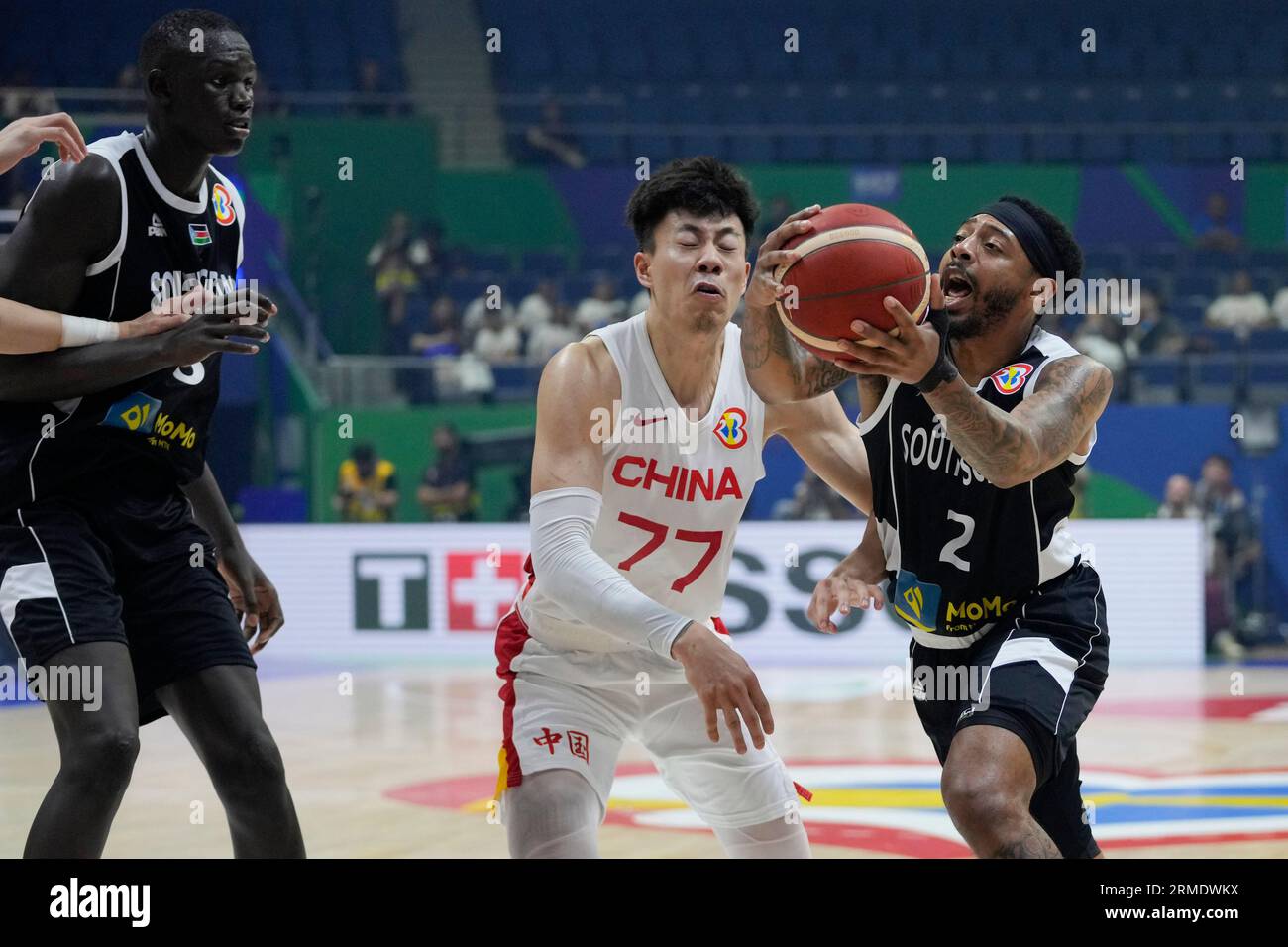 South Sudan guard Carlik Jones (2) against China forward Zhang Zhenlin (77) during their ...