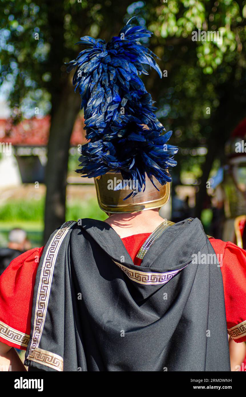 roman centurion with his back turned at a historical reenactment party ...