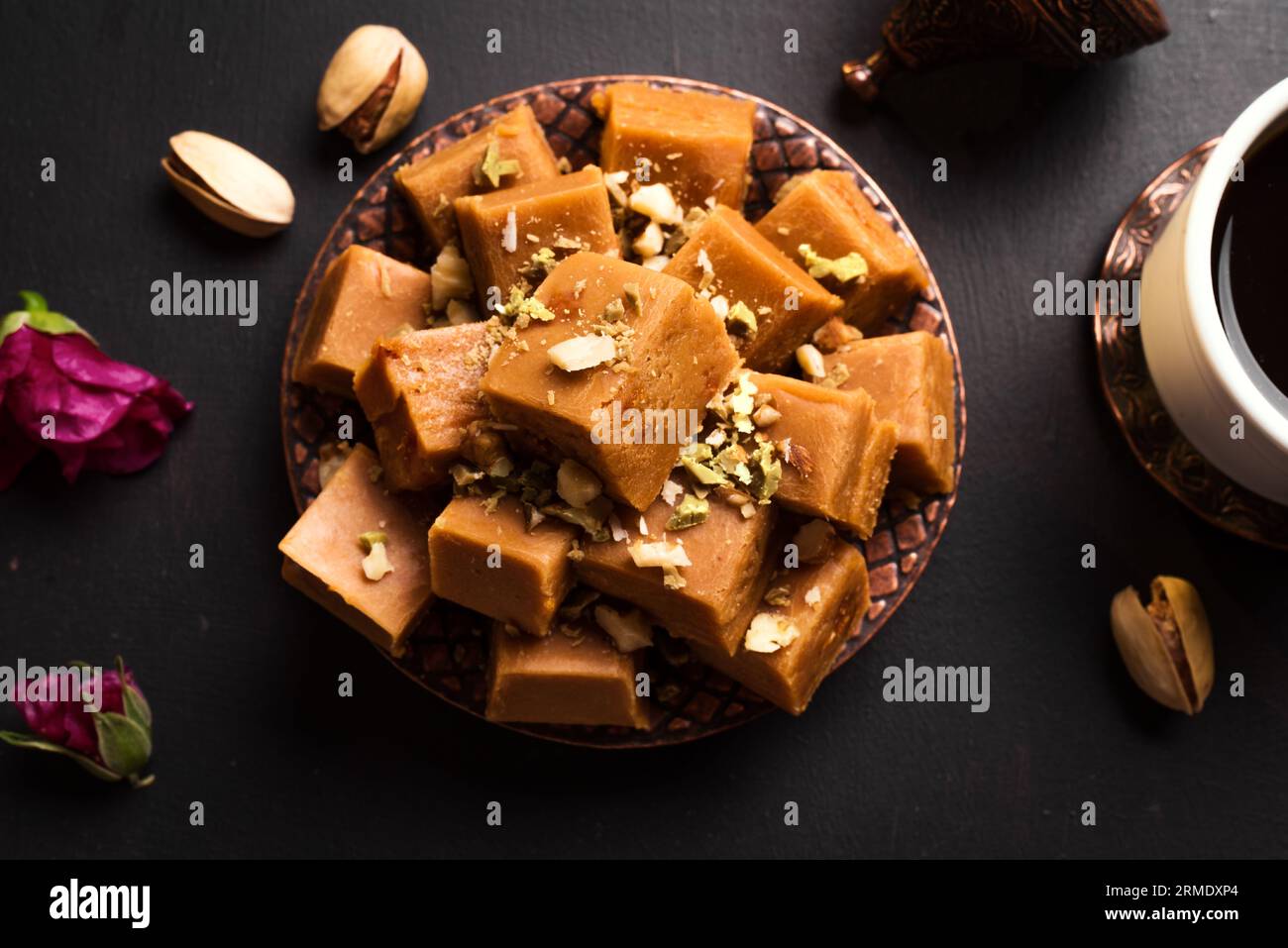 Caramel sherbet with pistachious nuts and turkish coffee on black ...