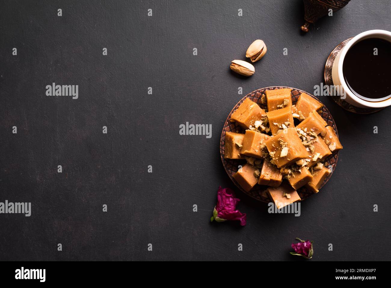Caramel sherbet with pistachious nuts and turkish coffee on black ...