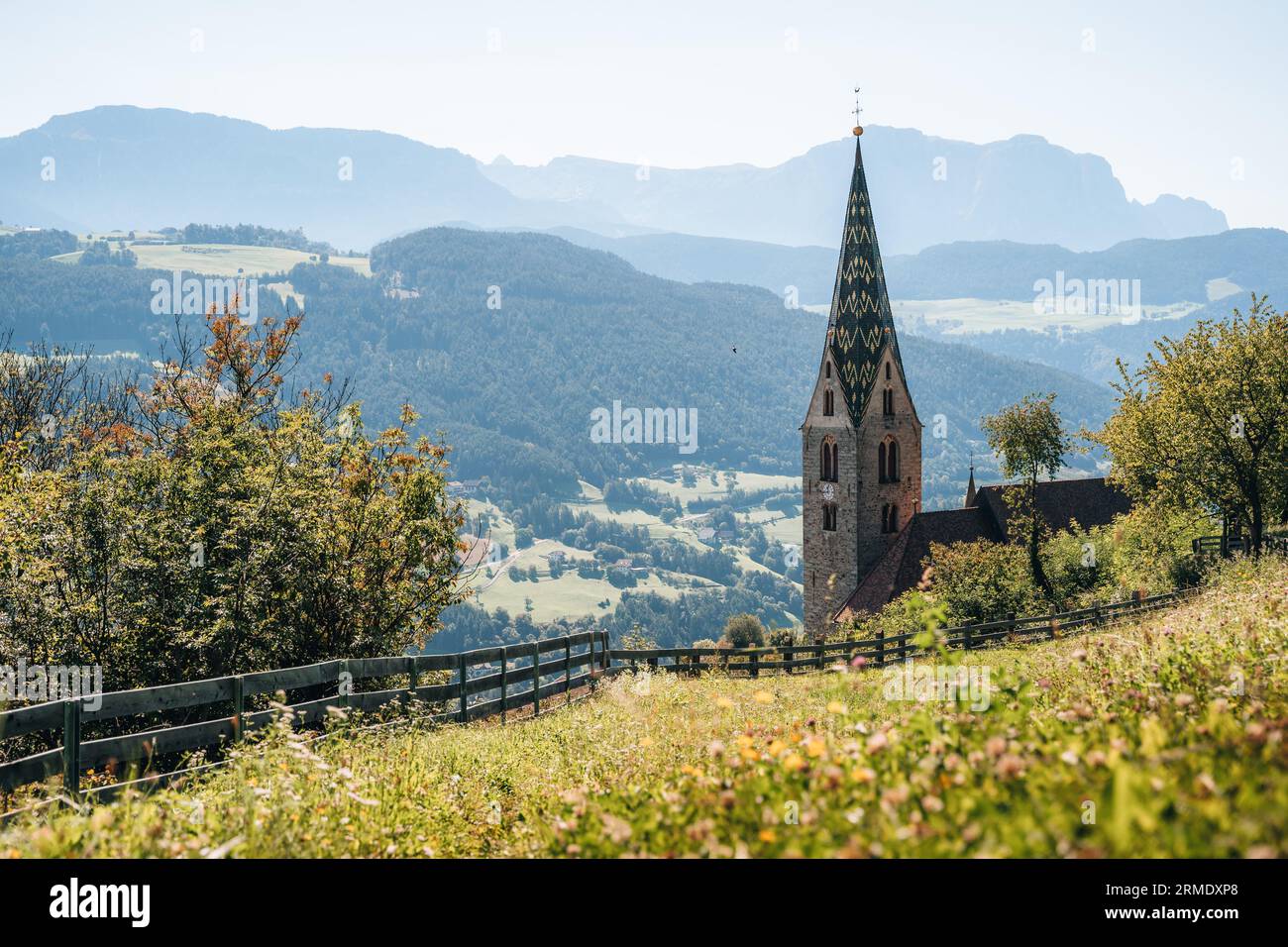 Church on a mountain overlooking valley in Villandro, Dolomites, Italy ...
