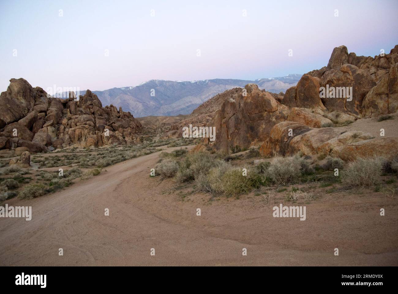 Dirt road winds through mountain hi-res stock photography and images ...