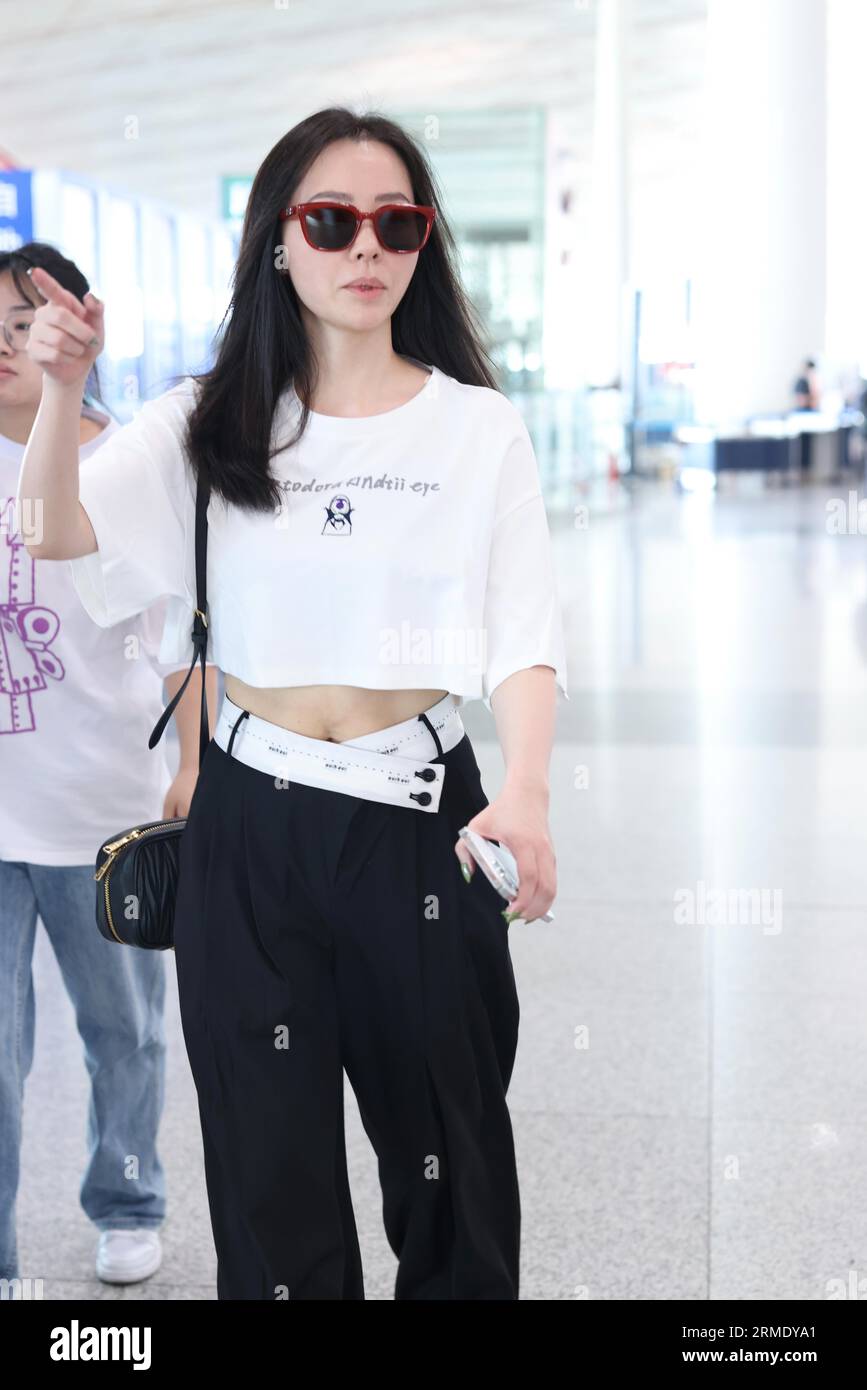 Chinese singer-songwriter Jane Zhang appears at the airport in Beijing ...