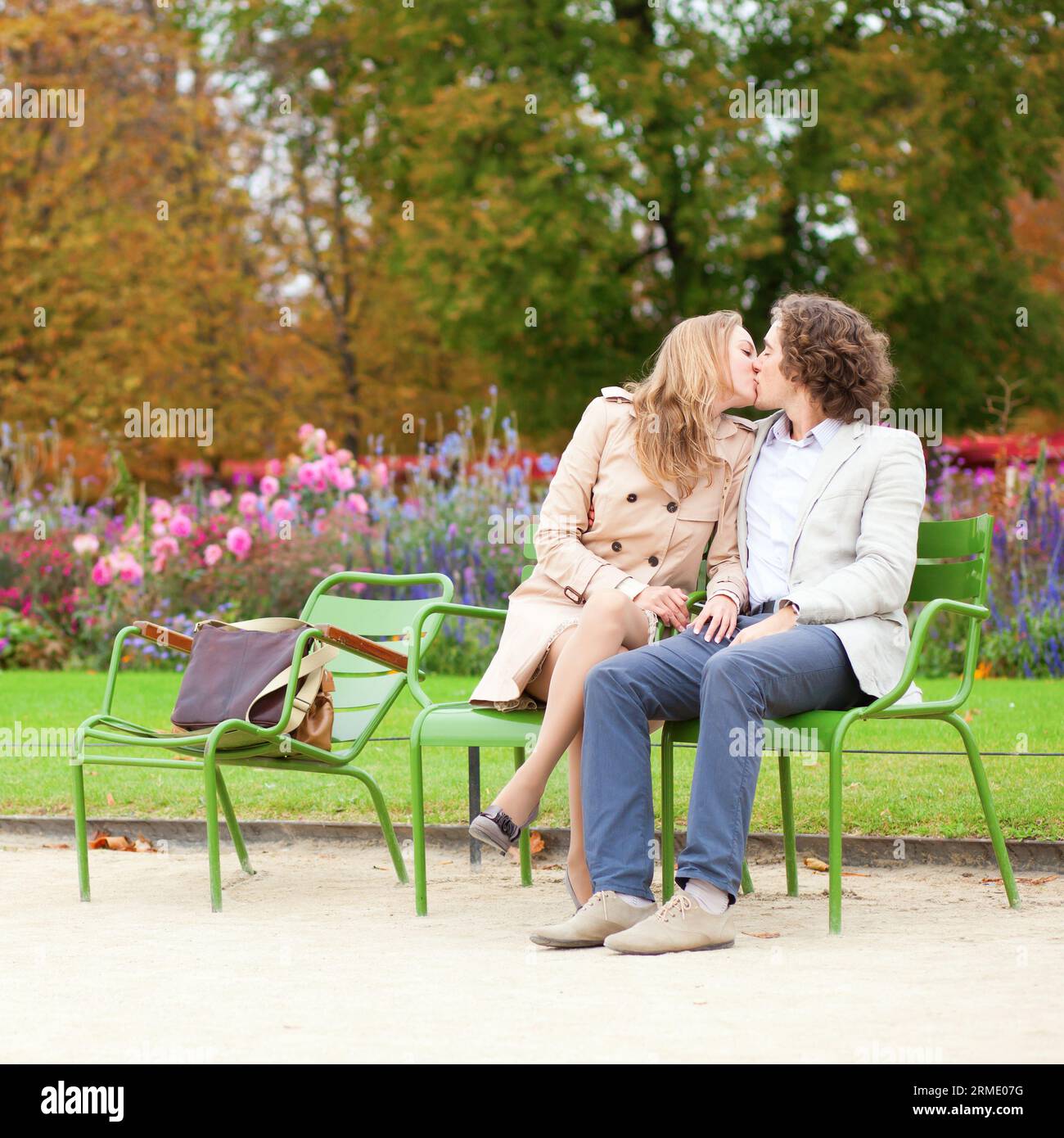 Romantic couple in a park, having a date Stock Photo - Alamy