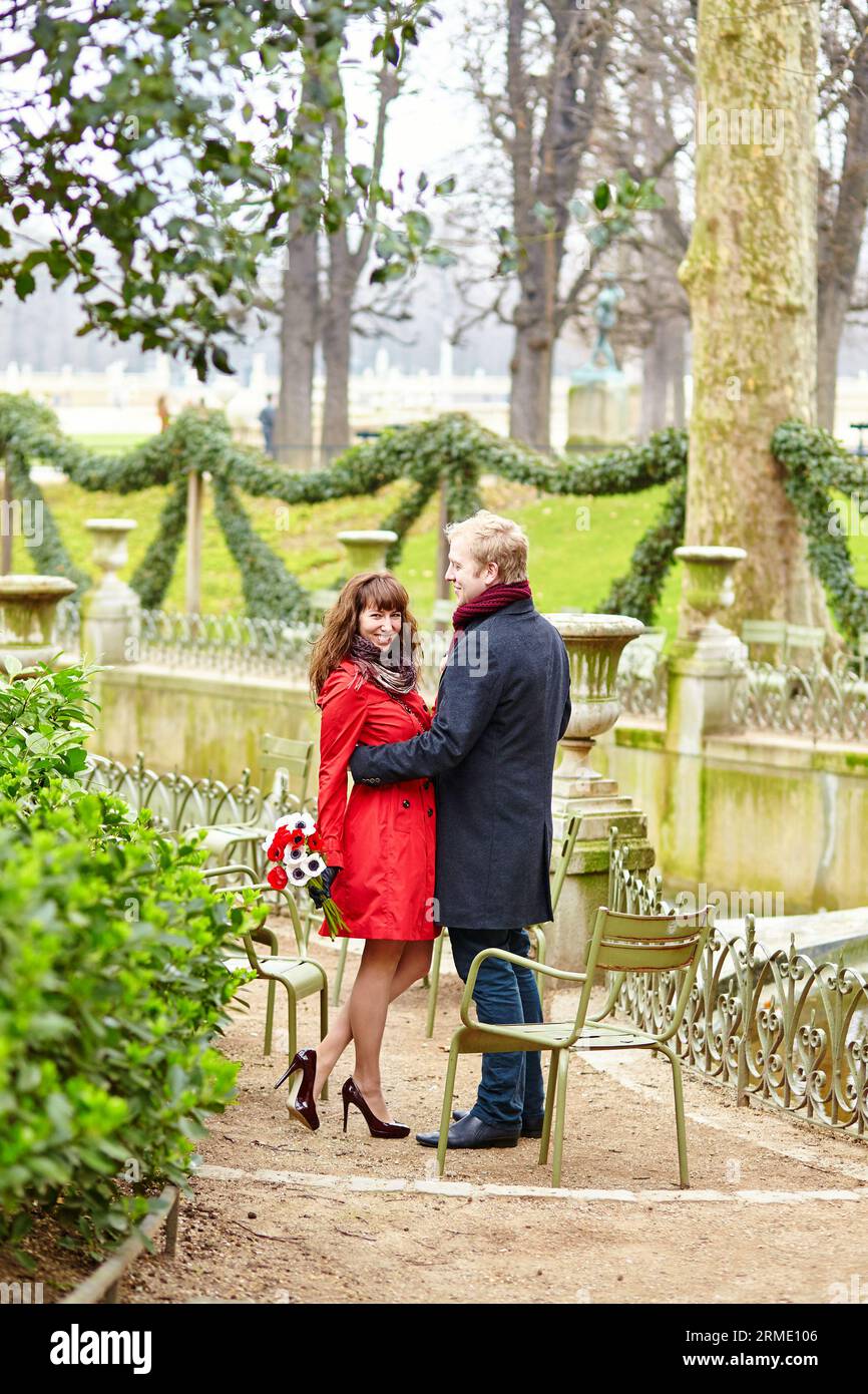 Romantic couple in a park at spring, dating Stock Photo - Alamy