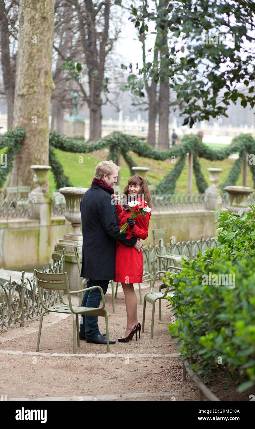 Romantic couple in a park at spring, dating Stock Photo - Alamy