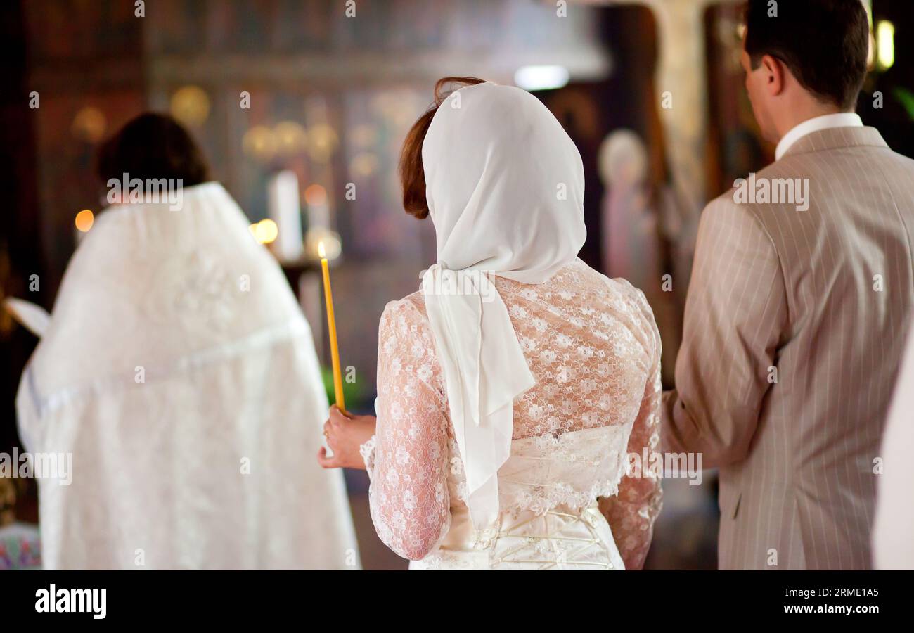 Bride and groom during orthodox wedding ceremony Stock Photo - Alamy