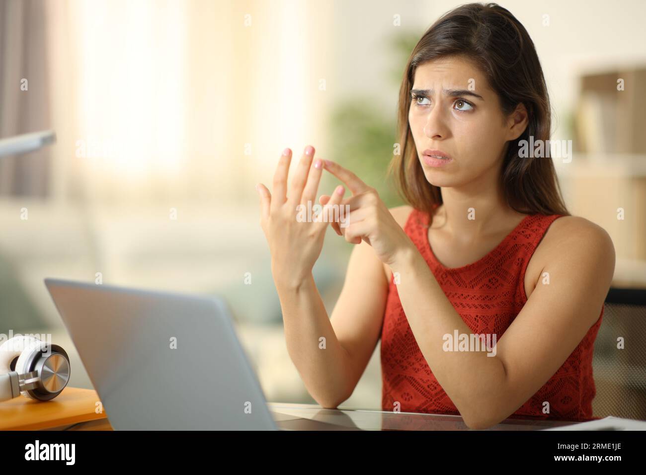 Student using fingers to calculate counting numbers sitting at home ...