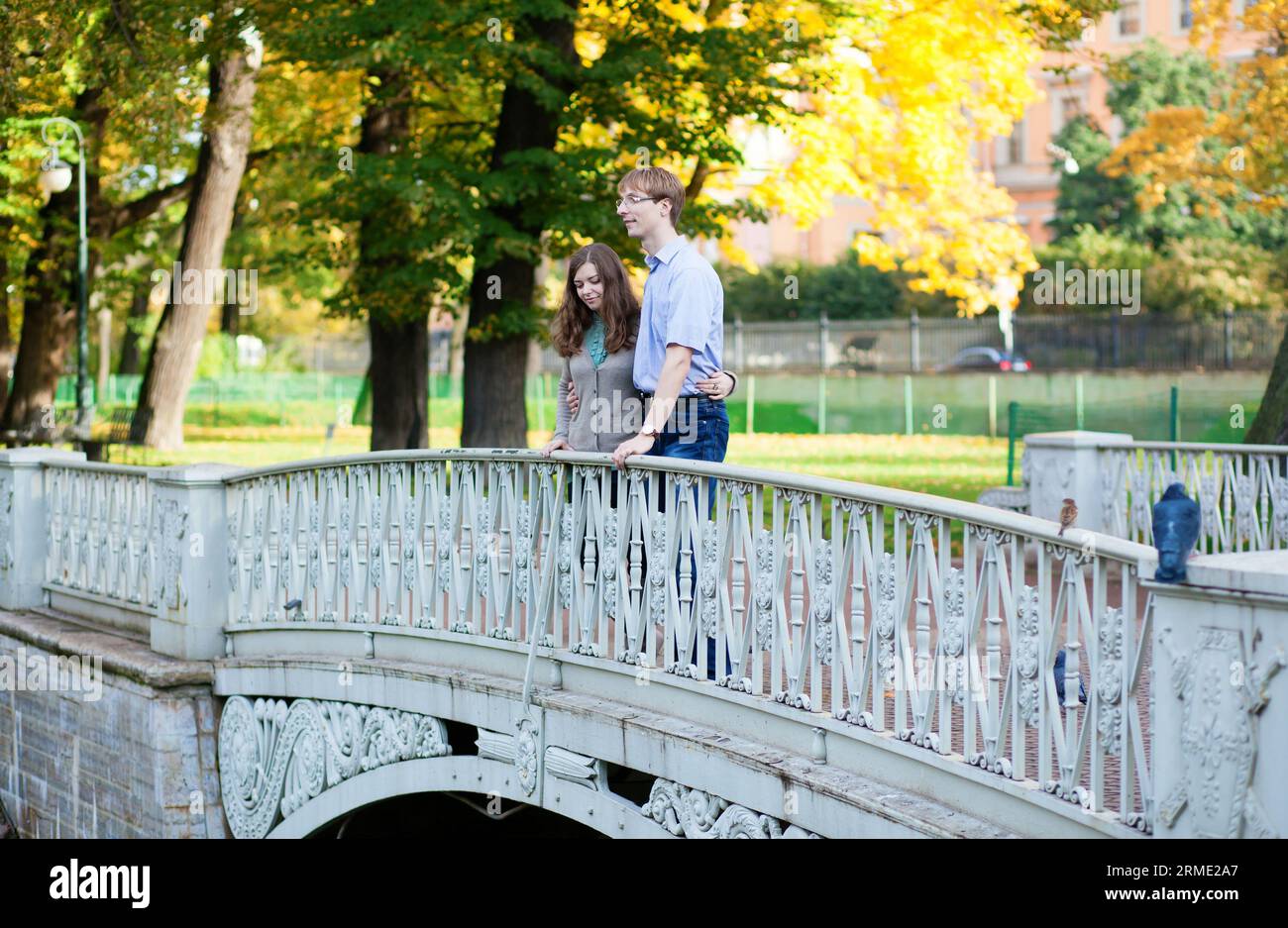 Romantic loveing couple on a bridge Stock Photo - Alamy